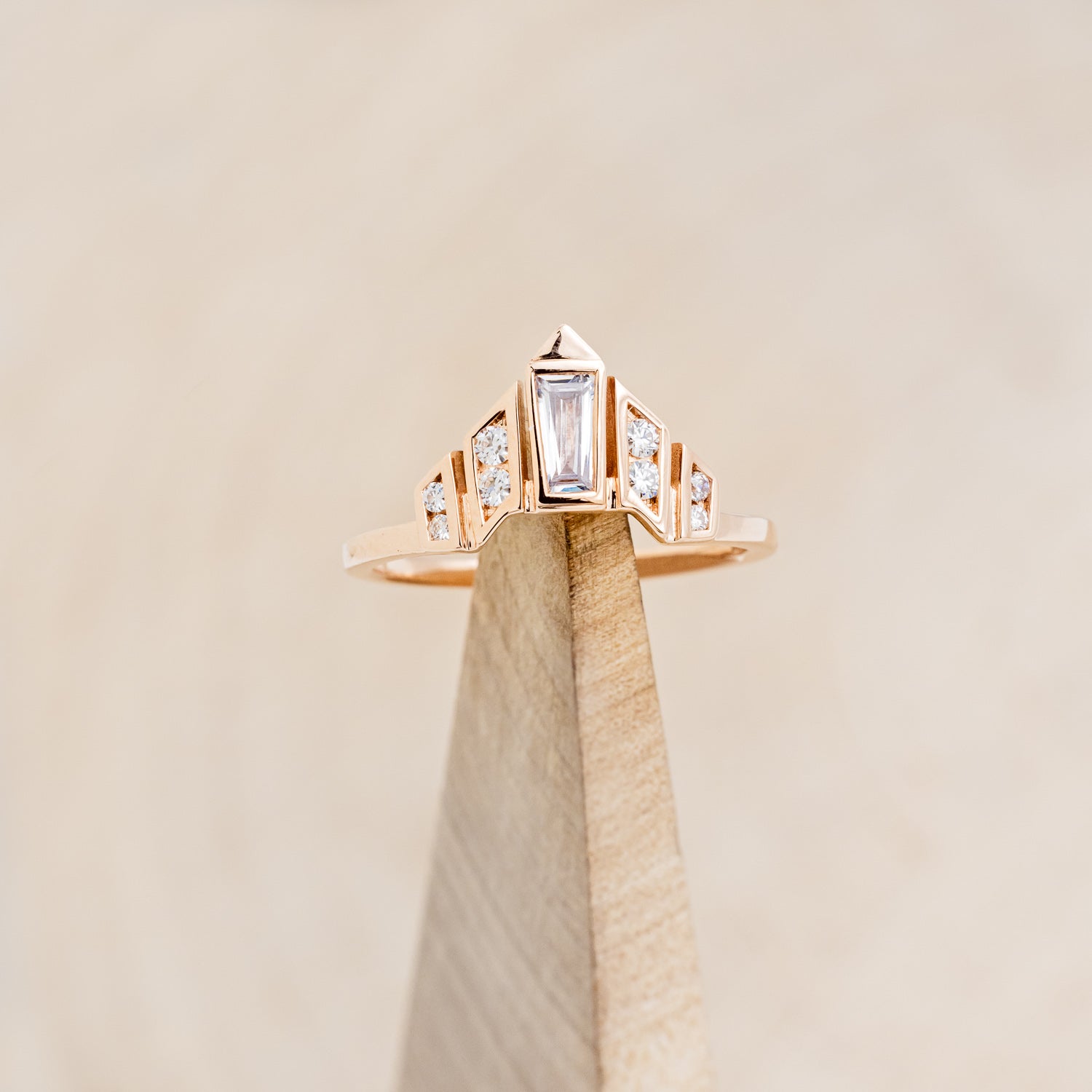 A BEZEL SET TAPERED MOISSANITE TRACER